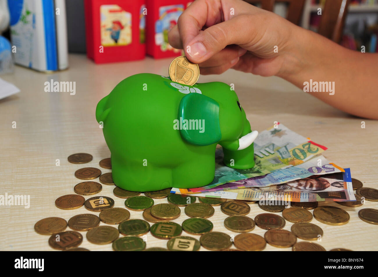 Saving coins hi-res stock photography and images - Alamy