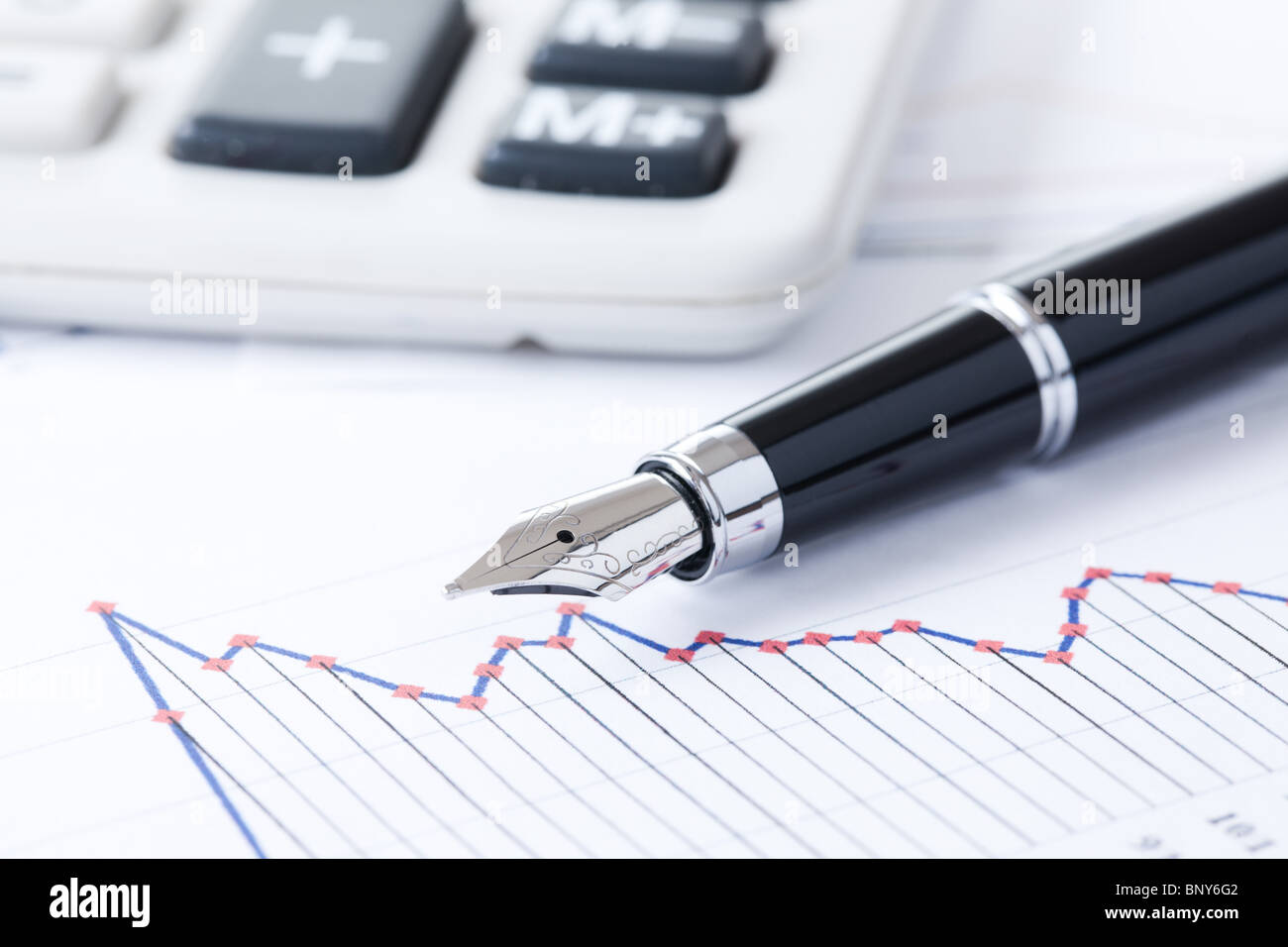 pen and business graph Stock Photo - Alamy