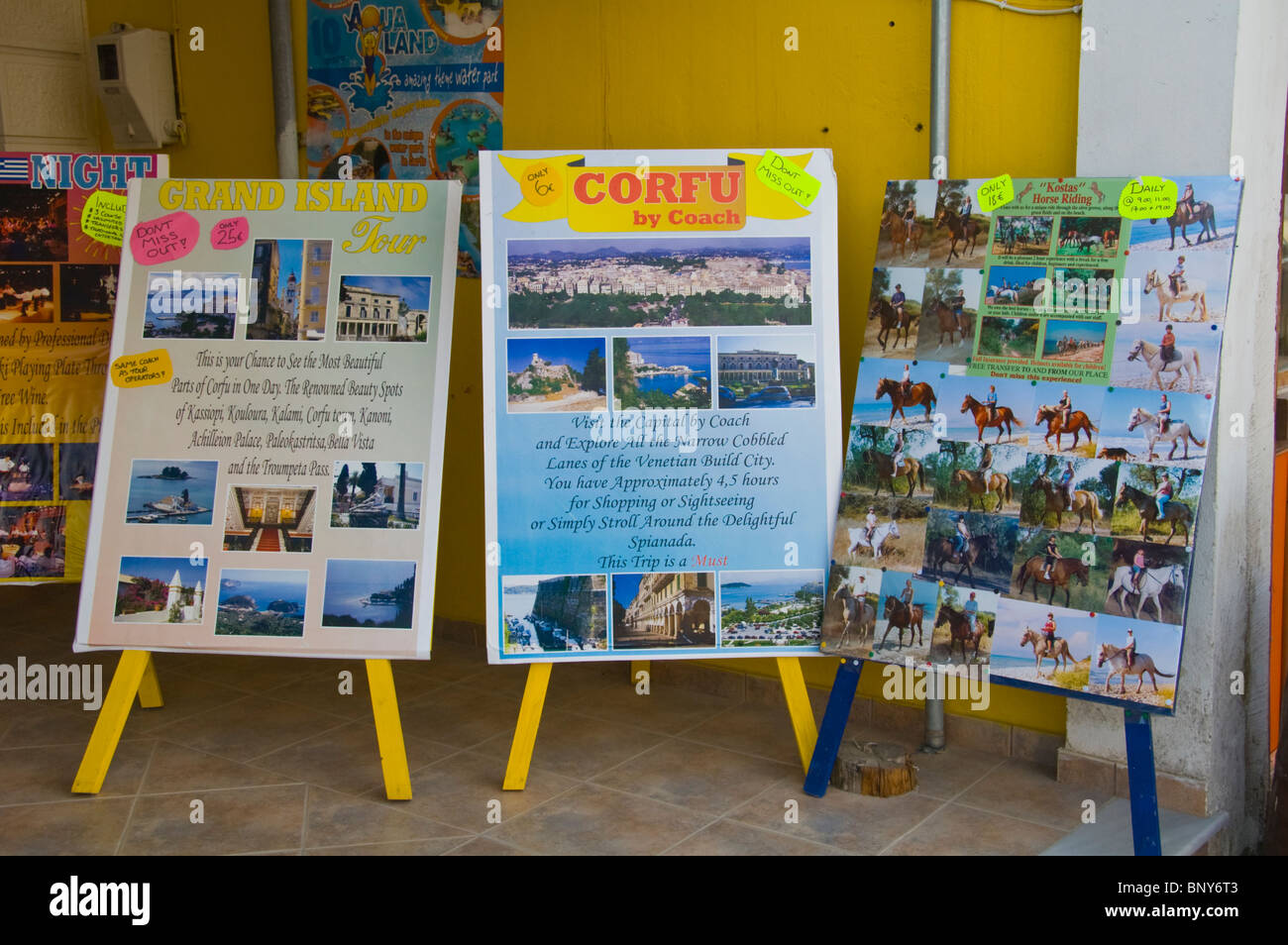 Signs outside tour company shop in Sidari on the Greek island of Corfu ...