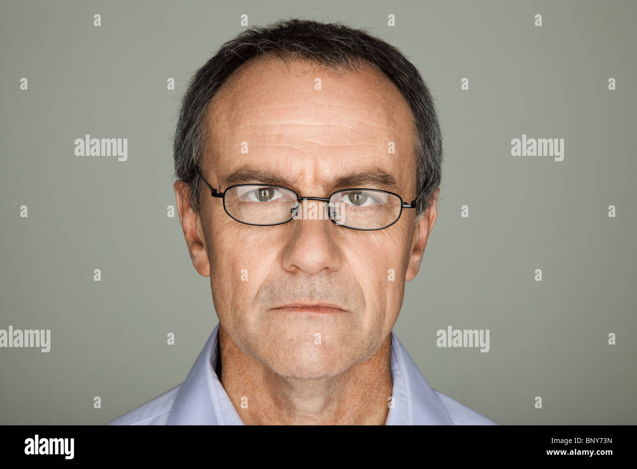 Mature man with serious expression on face, portrait Stock Photo - Alamy
