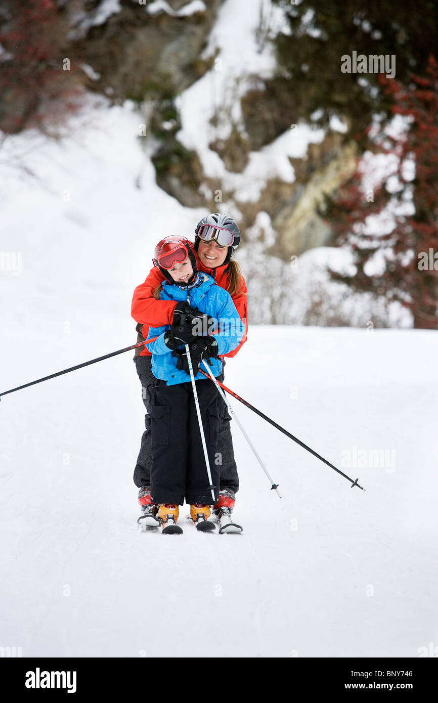 Mother and daughter skiing together Stock Photo - Alamy