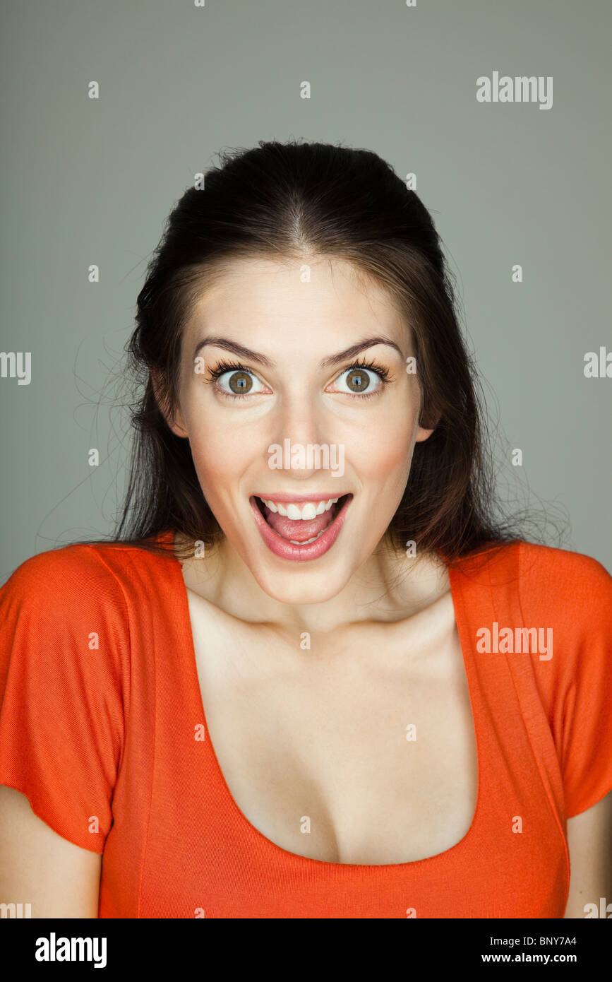 Young woman with look of surprise Stock Photo - Alamy
