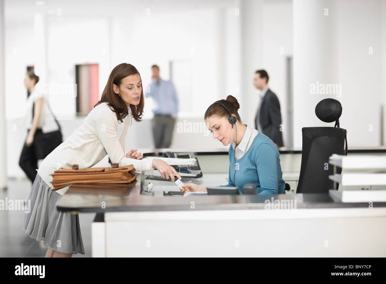 Bending pointing communication explaining hi-res stock photography and ...