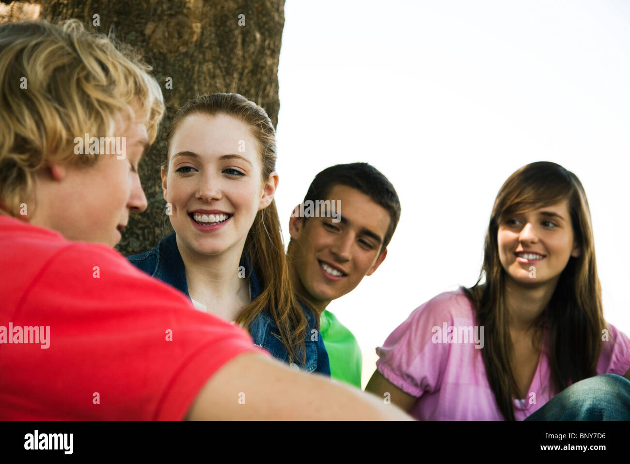 Young friends talking together outdoors Stock Photo - Alamy