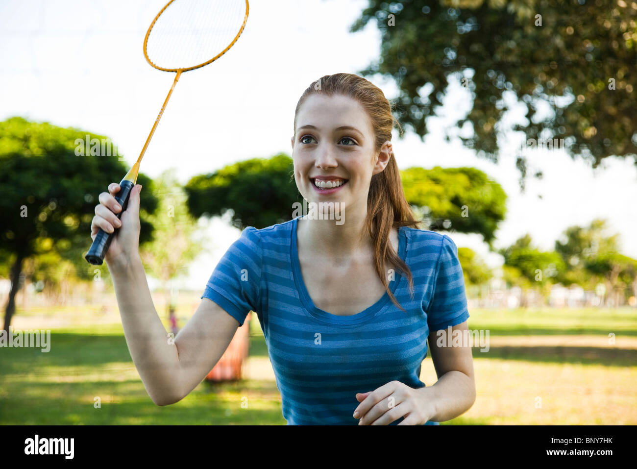 Teen girl playing badminton Stock Photo - Alamy
