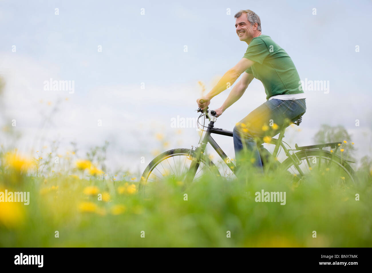 Man riding bike Stock Photo - Alamy