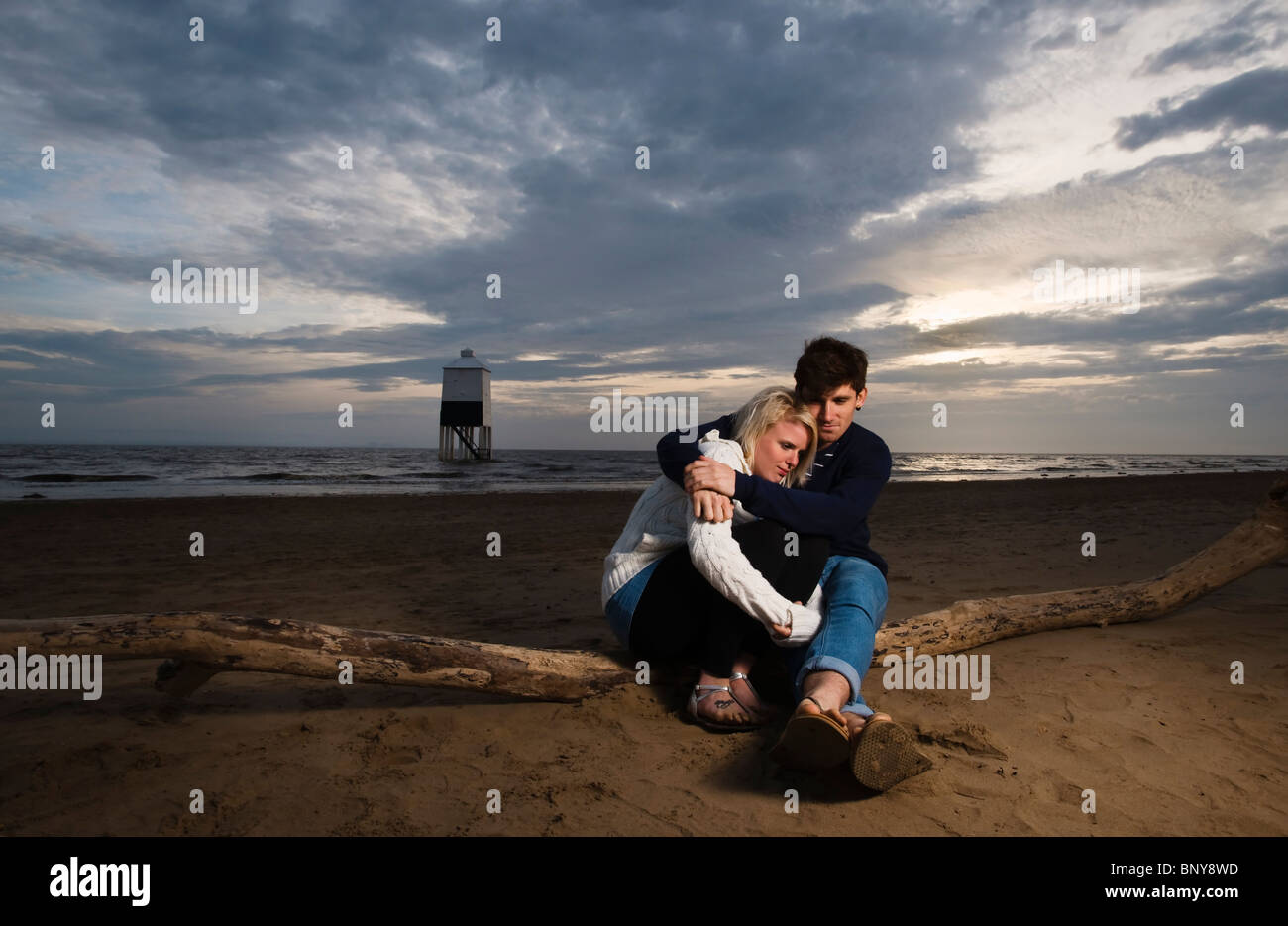 Couple sitting on beach night hi-res stock photography and images - Alamy