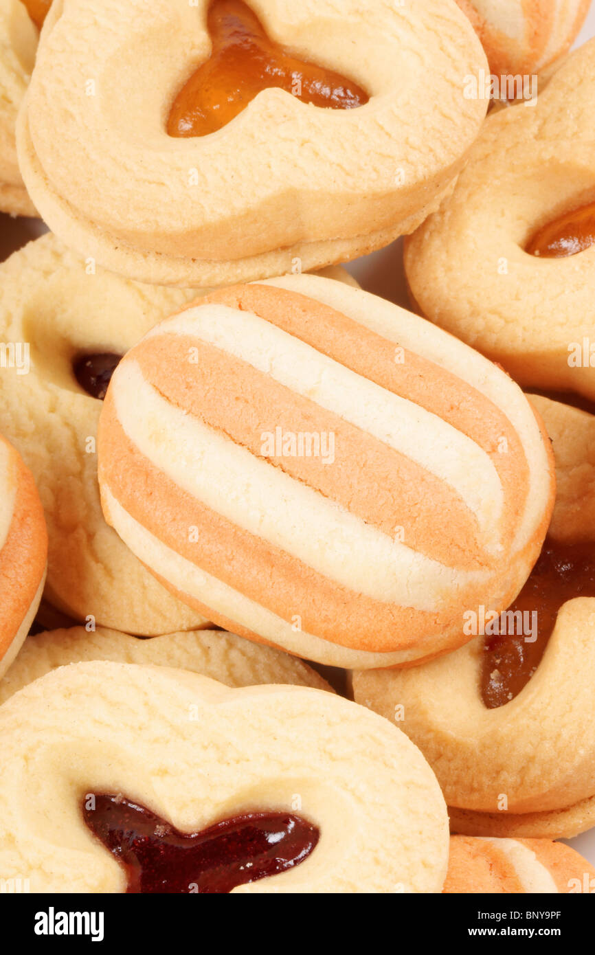 Close-up of some mixed shortcrust pastry biscuits with apricot and plum ...