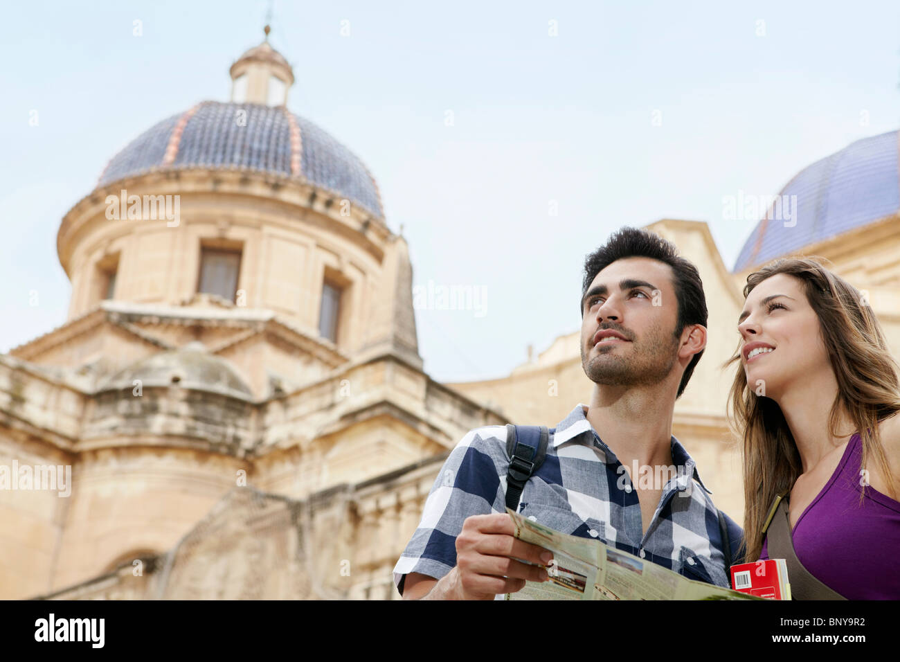 Tourists looking at sights Stock Photo - Alamy