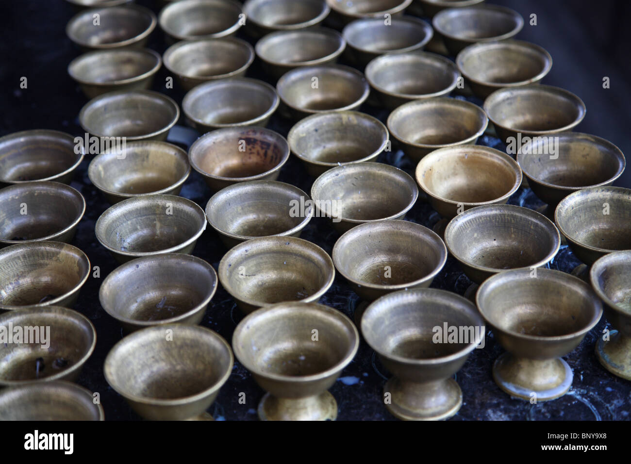 The brass vessels for butter lamp offerings in the Rumtek monastery ...