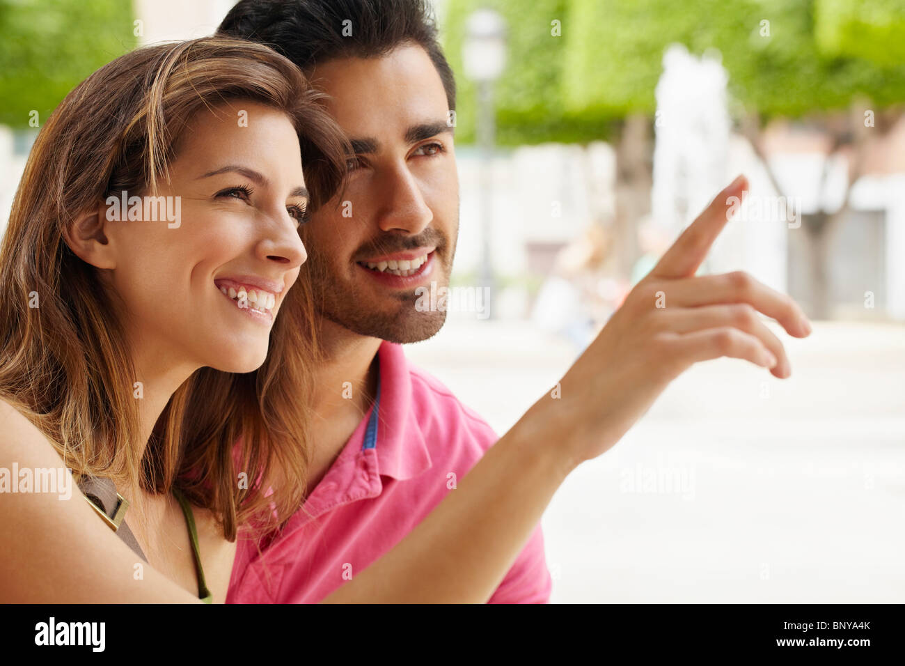 Attractive young couple in city square Stock Photo - Alamy