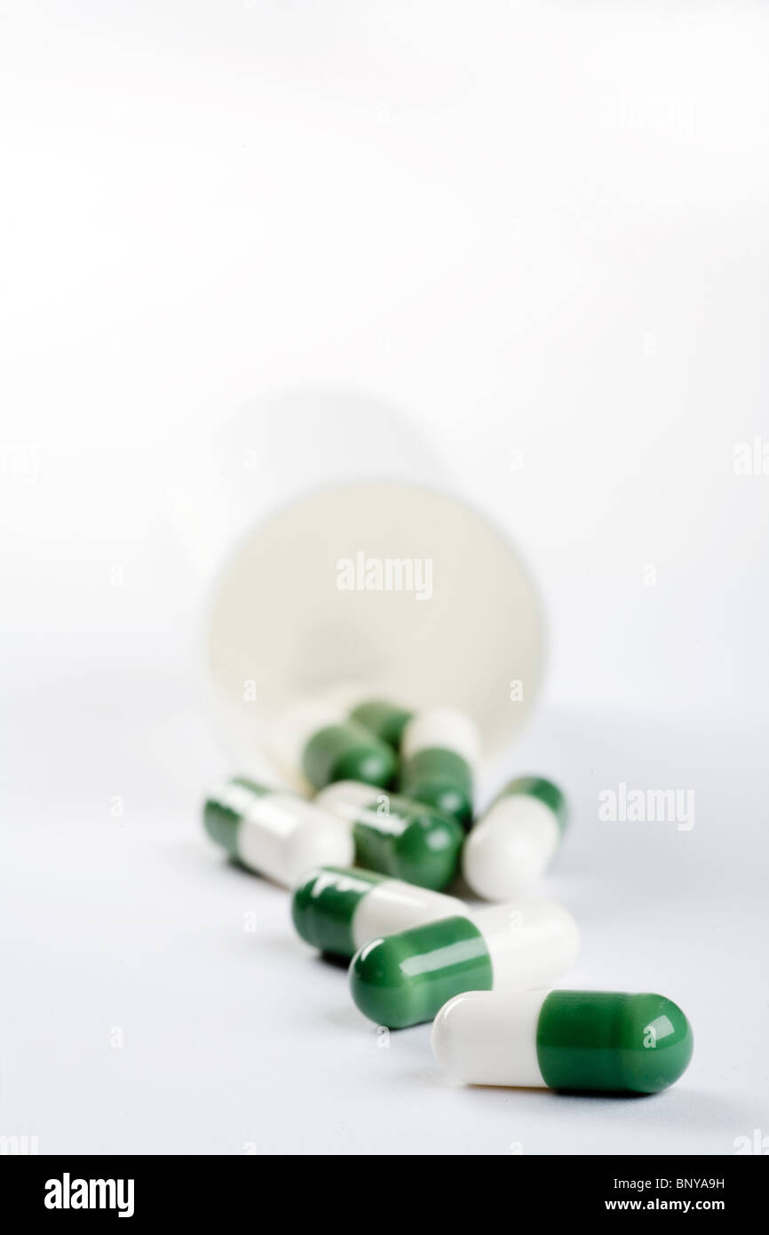 pack of green capsules isolated white background Stock Photo - Alamy