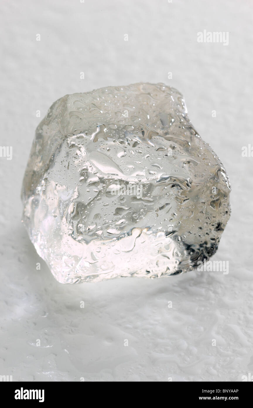 Single ice Cube close up on white b/g Stock Photo - Alamy