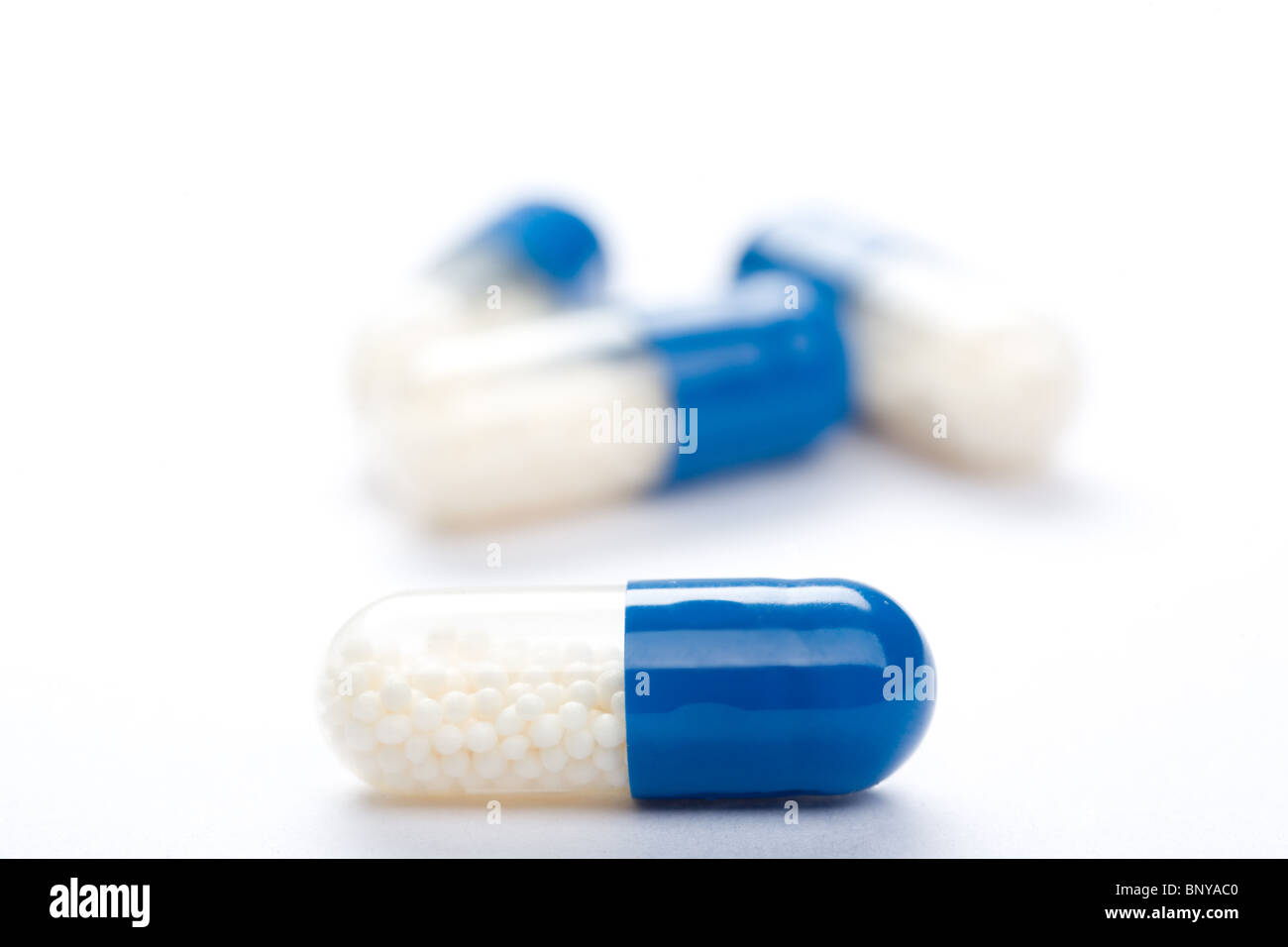 close-up of blue medical capsules isolated on white background Stock ...