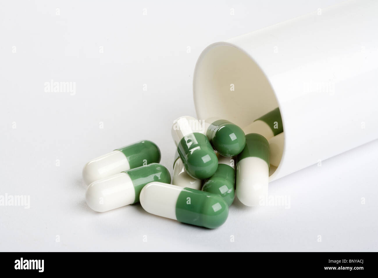 pack of green capsules isolated white background Stock Photo - Alamy