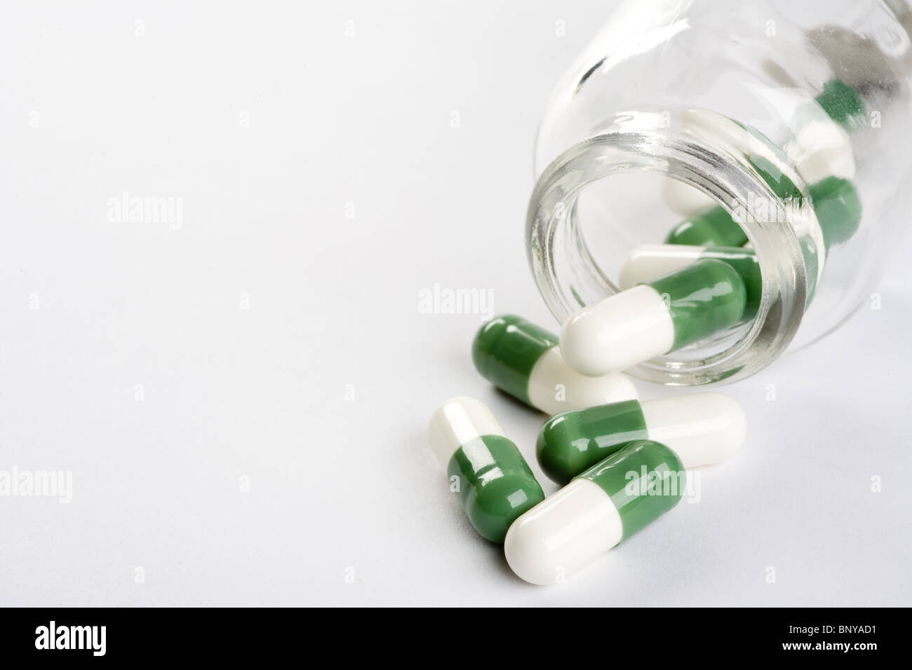 pack of green capsules isolated white background Stock Photo - Alamy