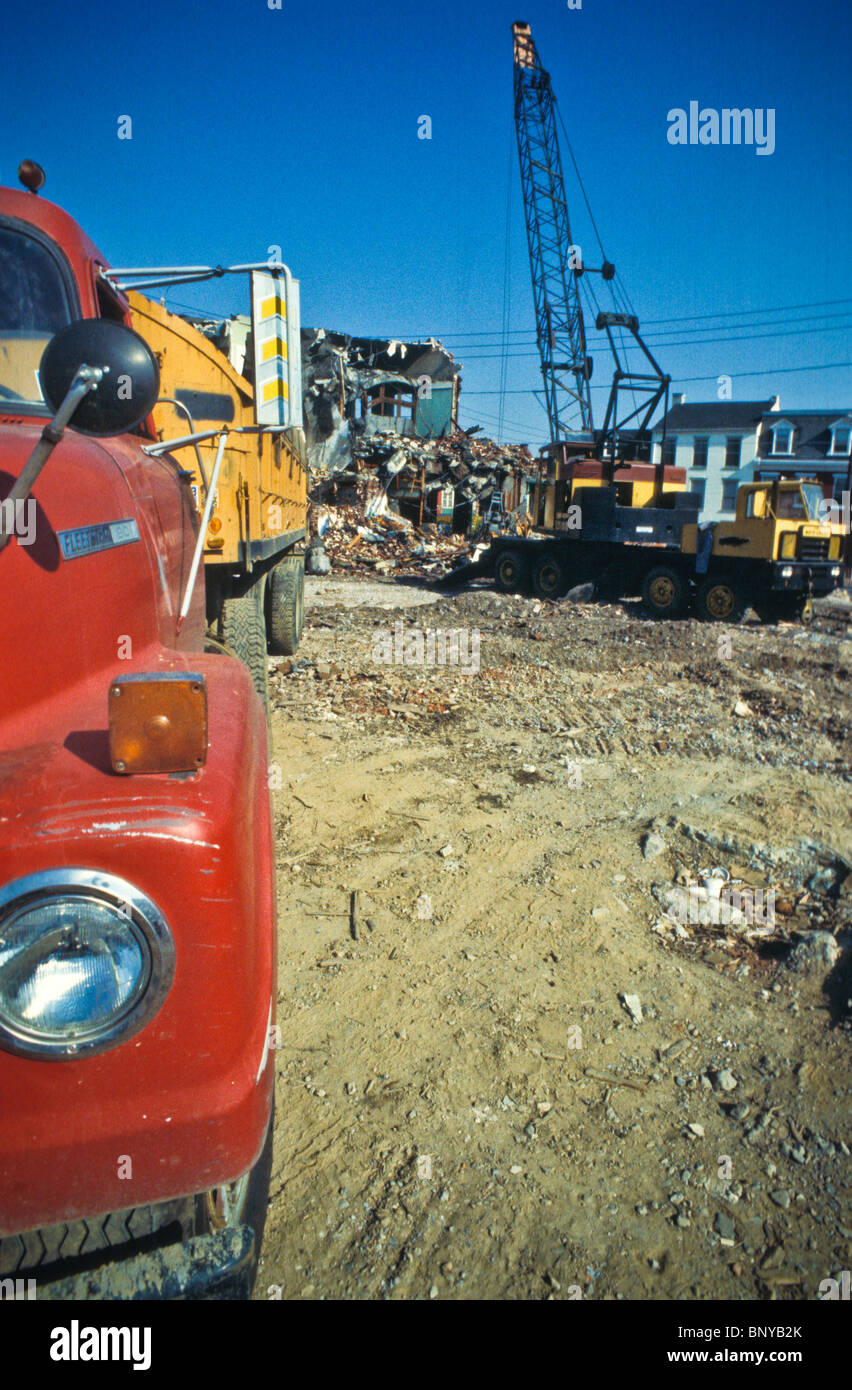 Crane removes debris from demolition area Stock Photo - Alamy