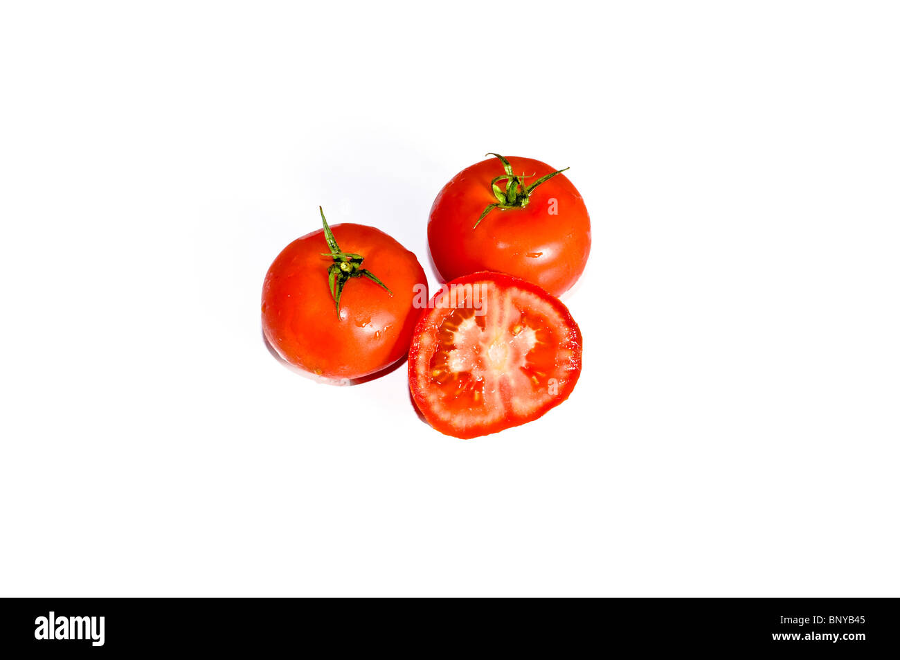 Sliced and normal tomatoes isolated on white background Stock Photo - Alamy