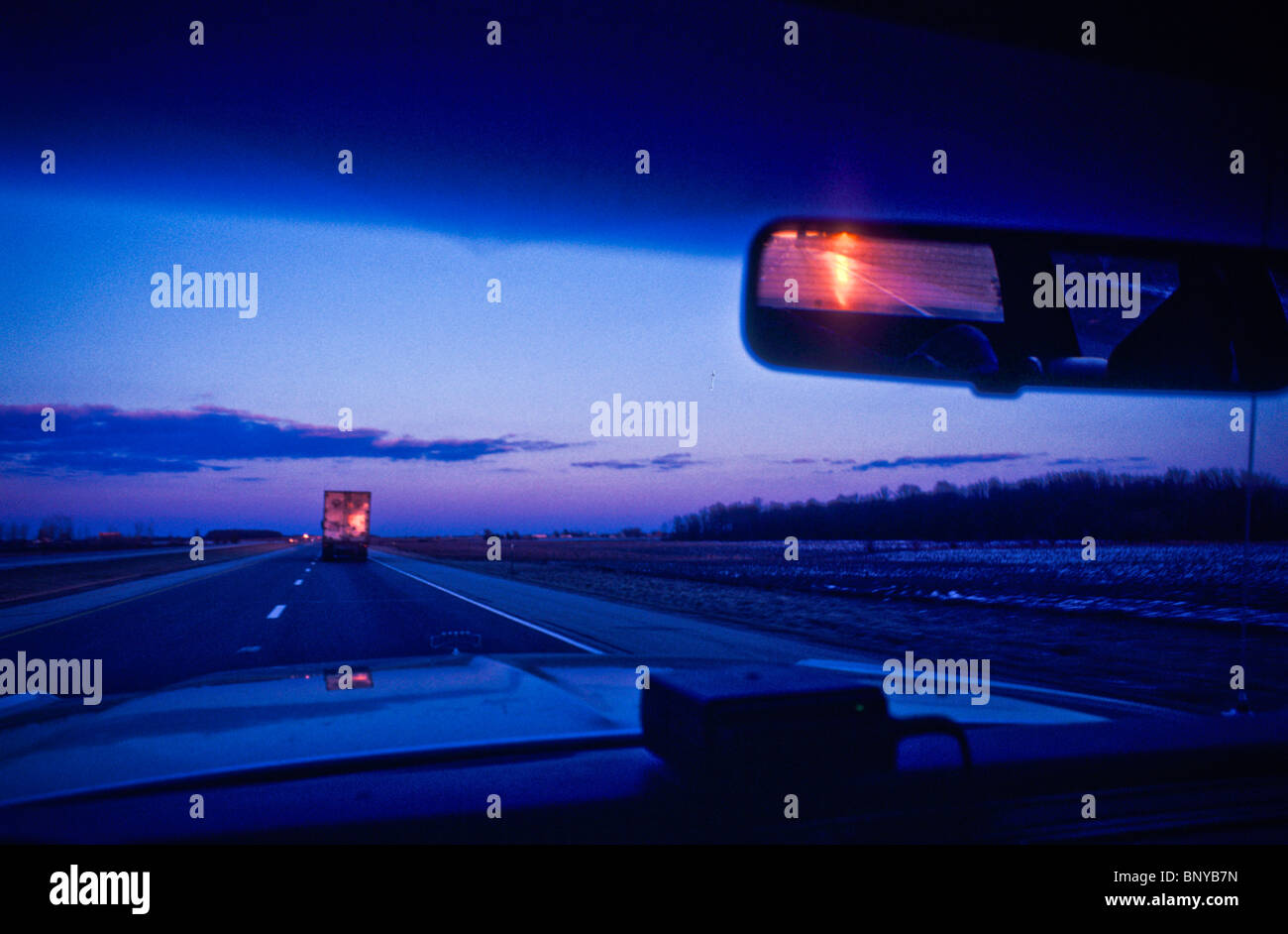 Windshield view of highway Rear view mirror Stock Photo - Alamy