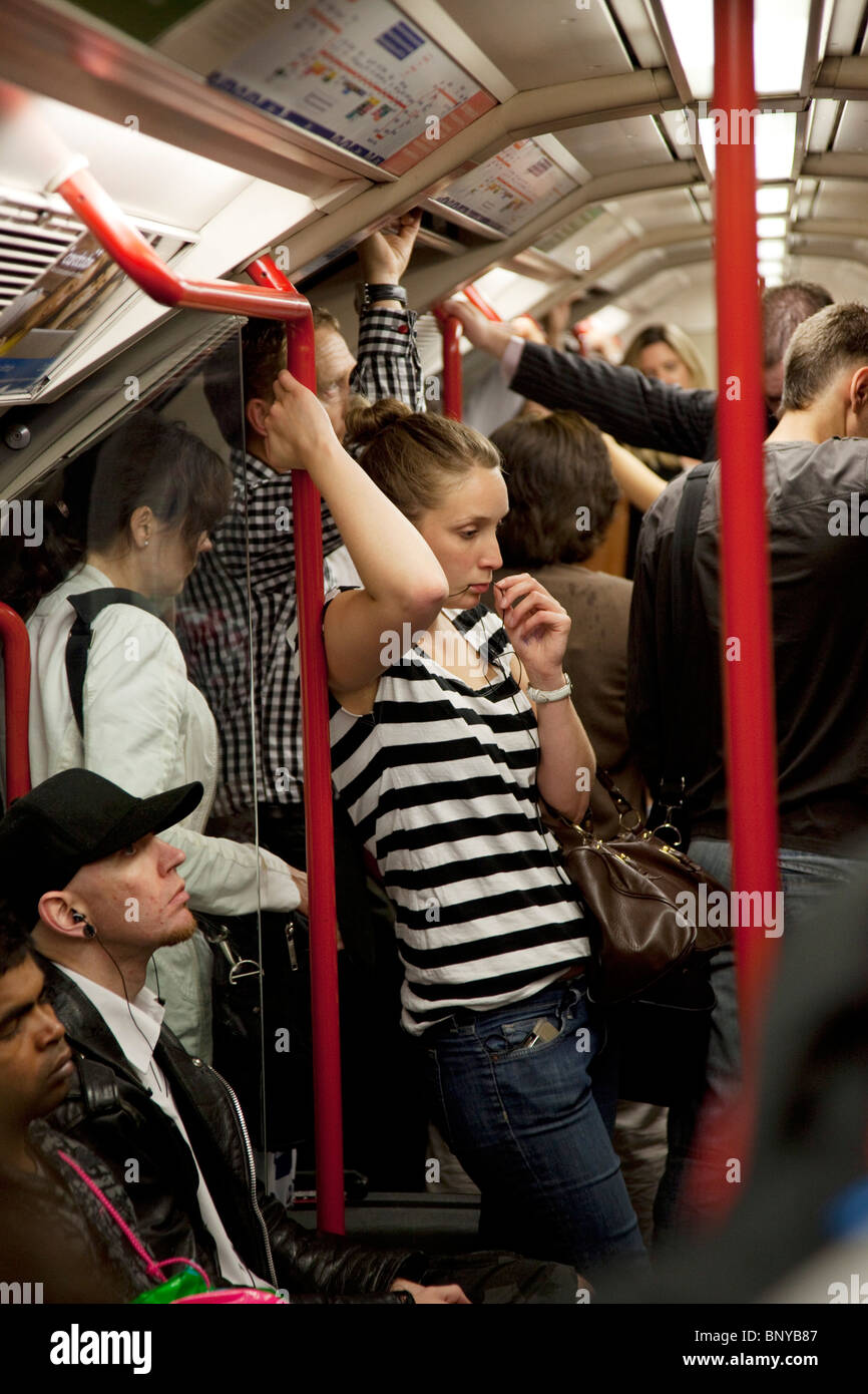 Passenger in deep thought on a Central Line London Underground tube ...
