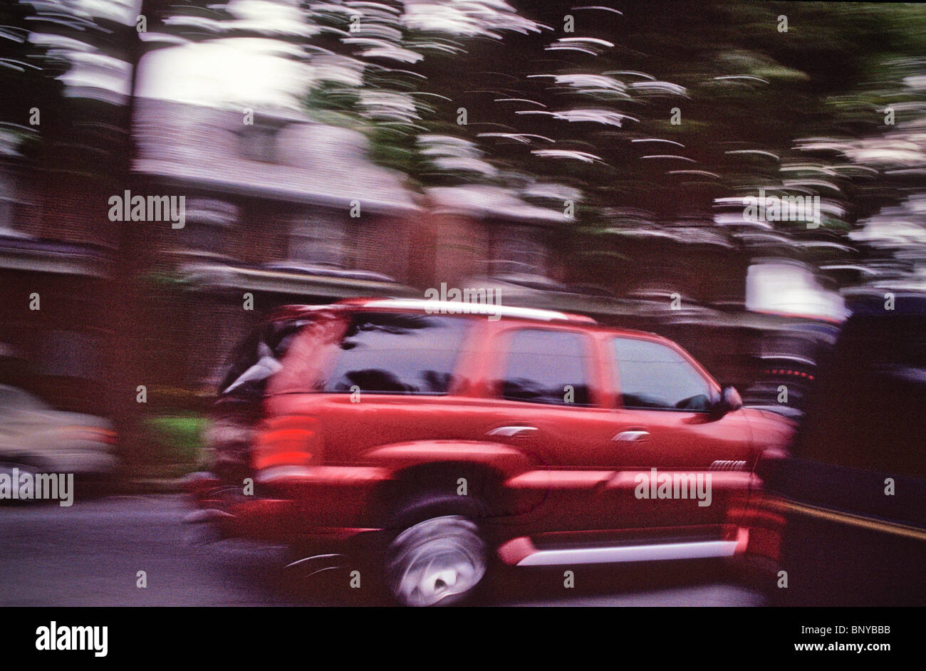 One red car speeds Stock Photo - Alamy