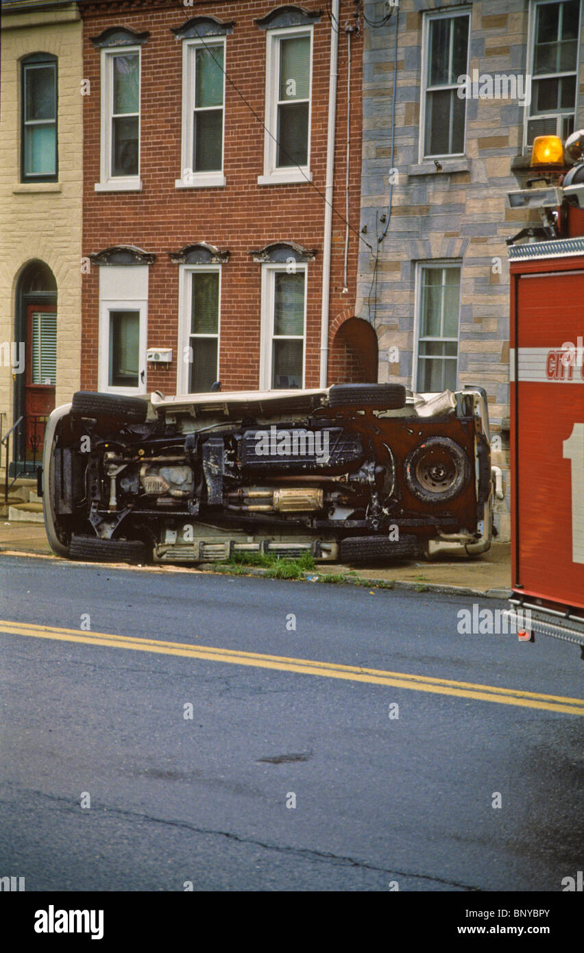 Over turned car at accident scene, police and fire truck Stock Photo ...
