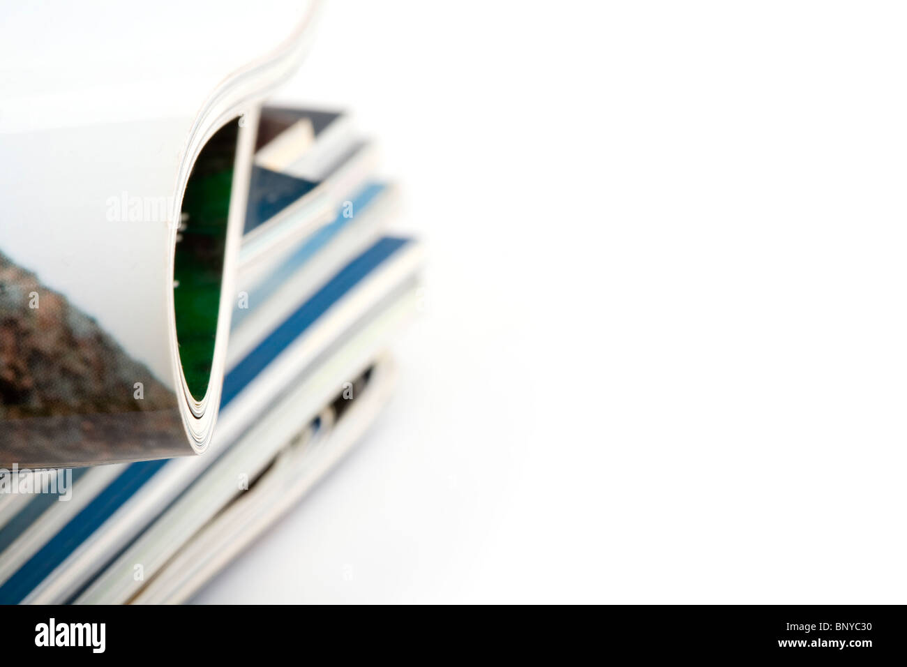 Stack of magazines studio isolated on white background with space for ...