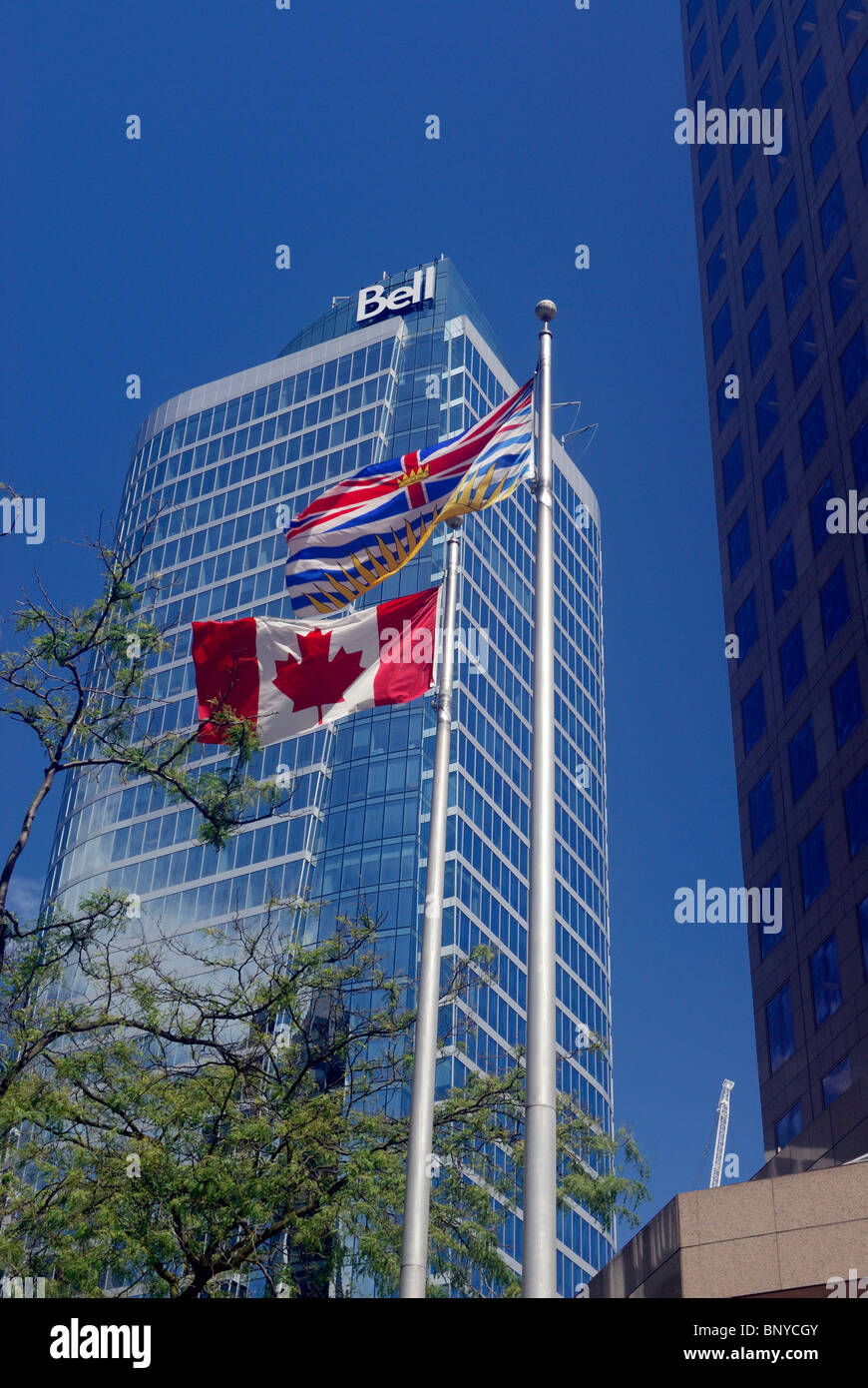 Bell Glass office tower with the Canadian and British Columbia flags in ...