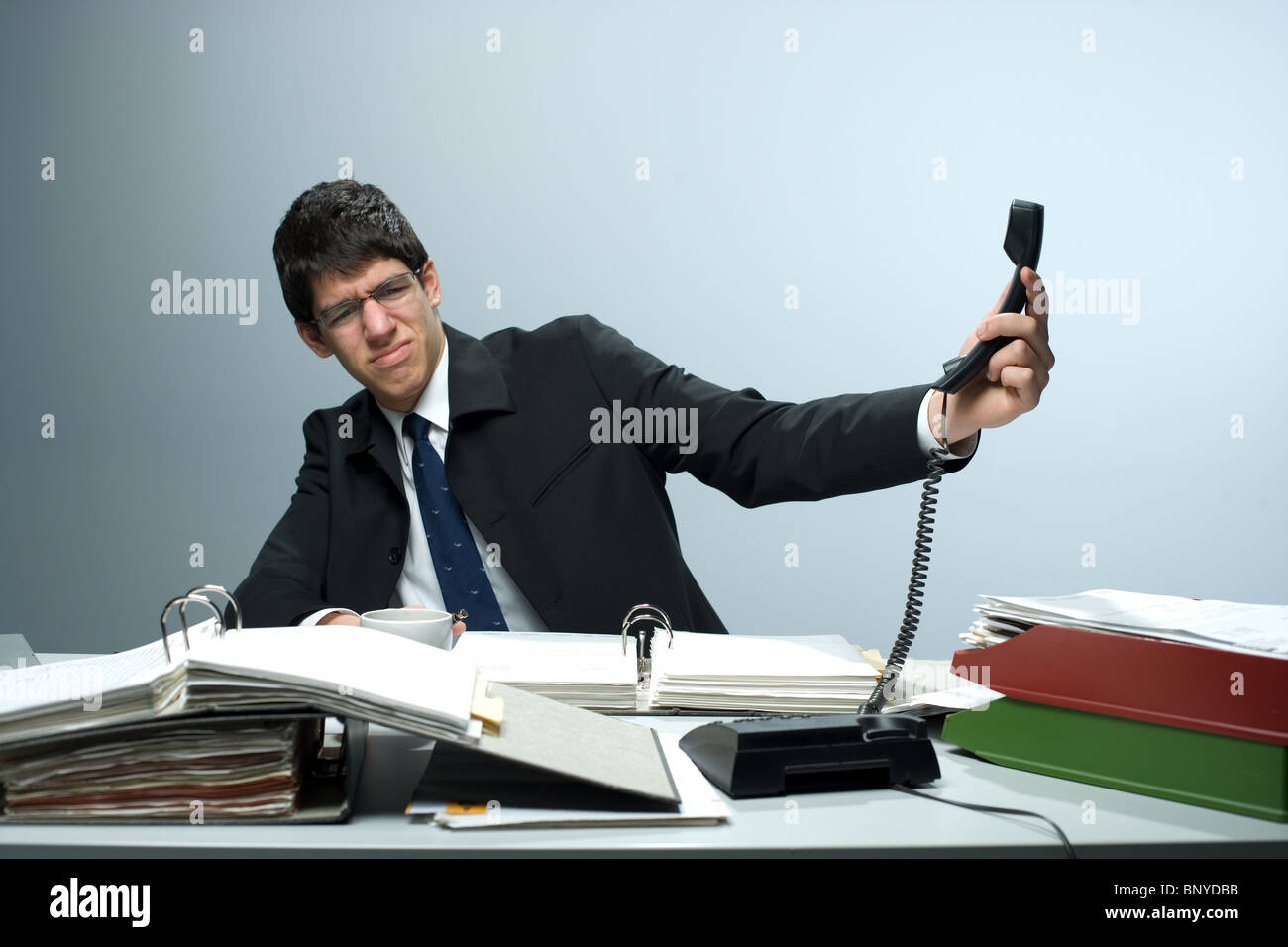 Bookkeeper making a phone call at work Stock Photo - Alamy