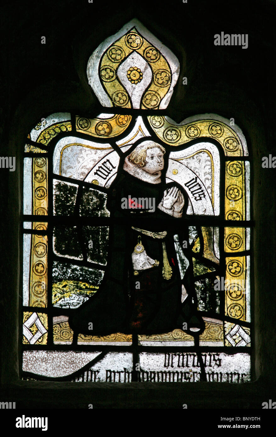 A 15th century stained glass window depicting Henry Rowarth or Rumworth ...
