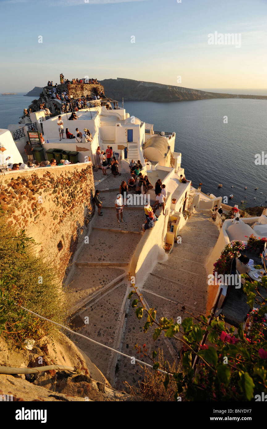 Crowds of tourists gathered to see the sunset at Oia on the Greek ...
