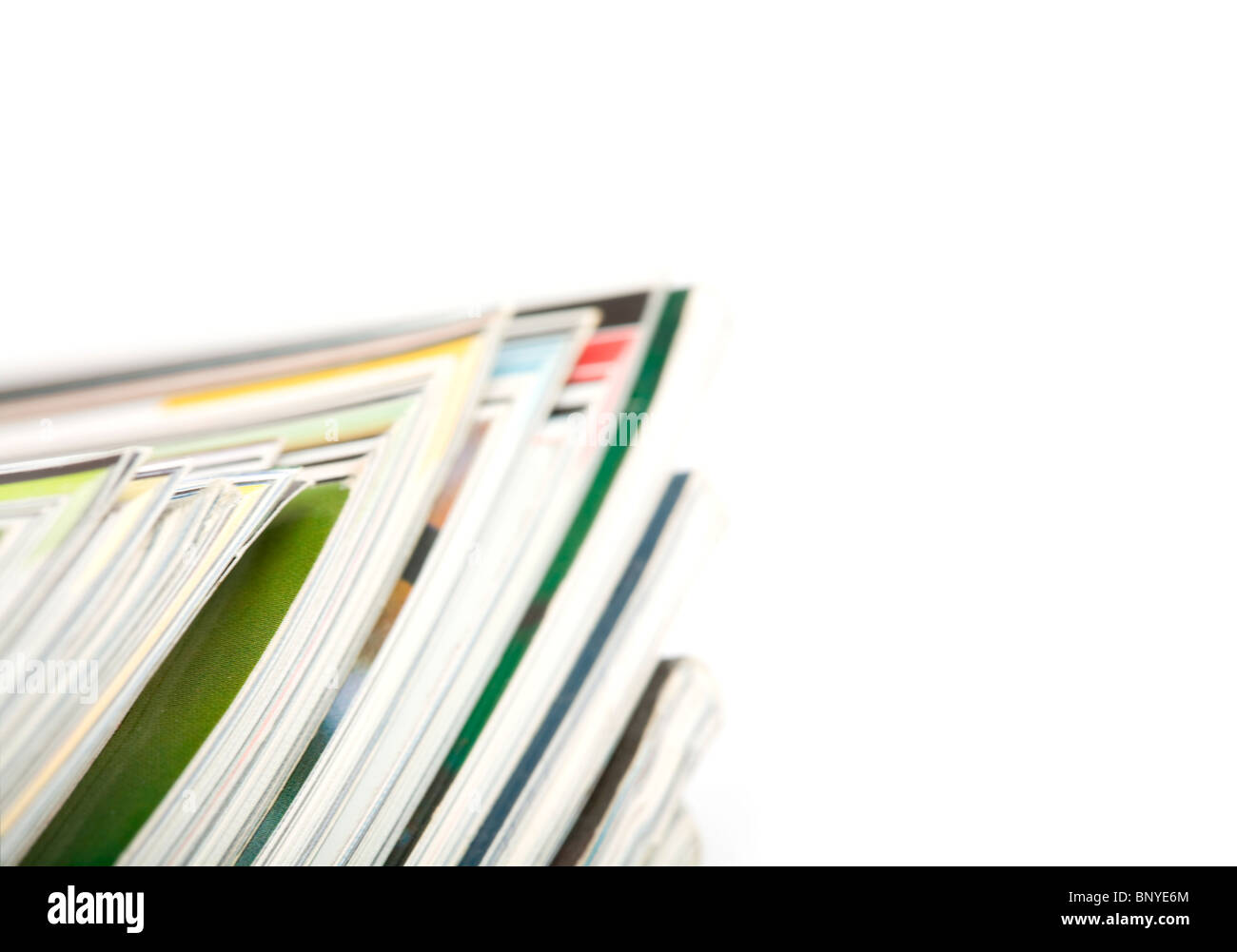 Stack of magazines studio isolated on white background Stock Photo - Alamy