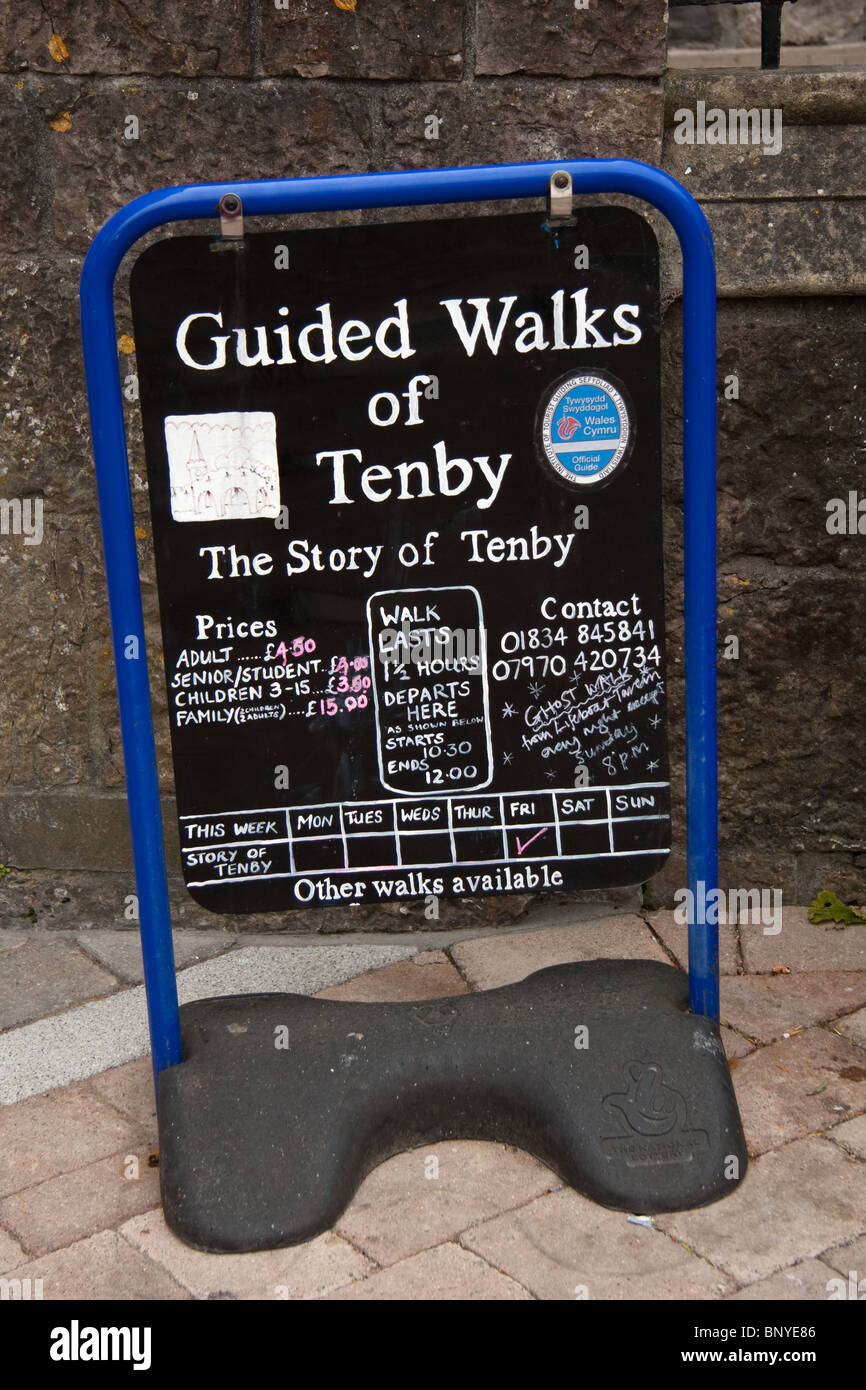 Sign advertising Walking Tours of Tenby Stock Photo - Alamy