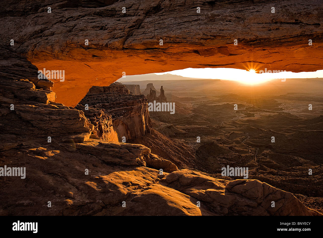 A morning sun is turned into a sunstar as it strikes the lower edge of ...