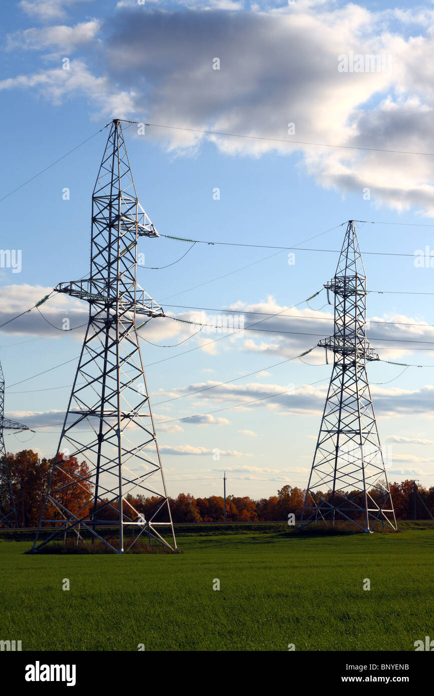 sunset landscape with electricity cable communication towers Stock ...