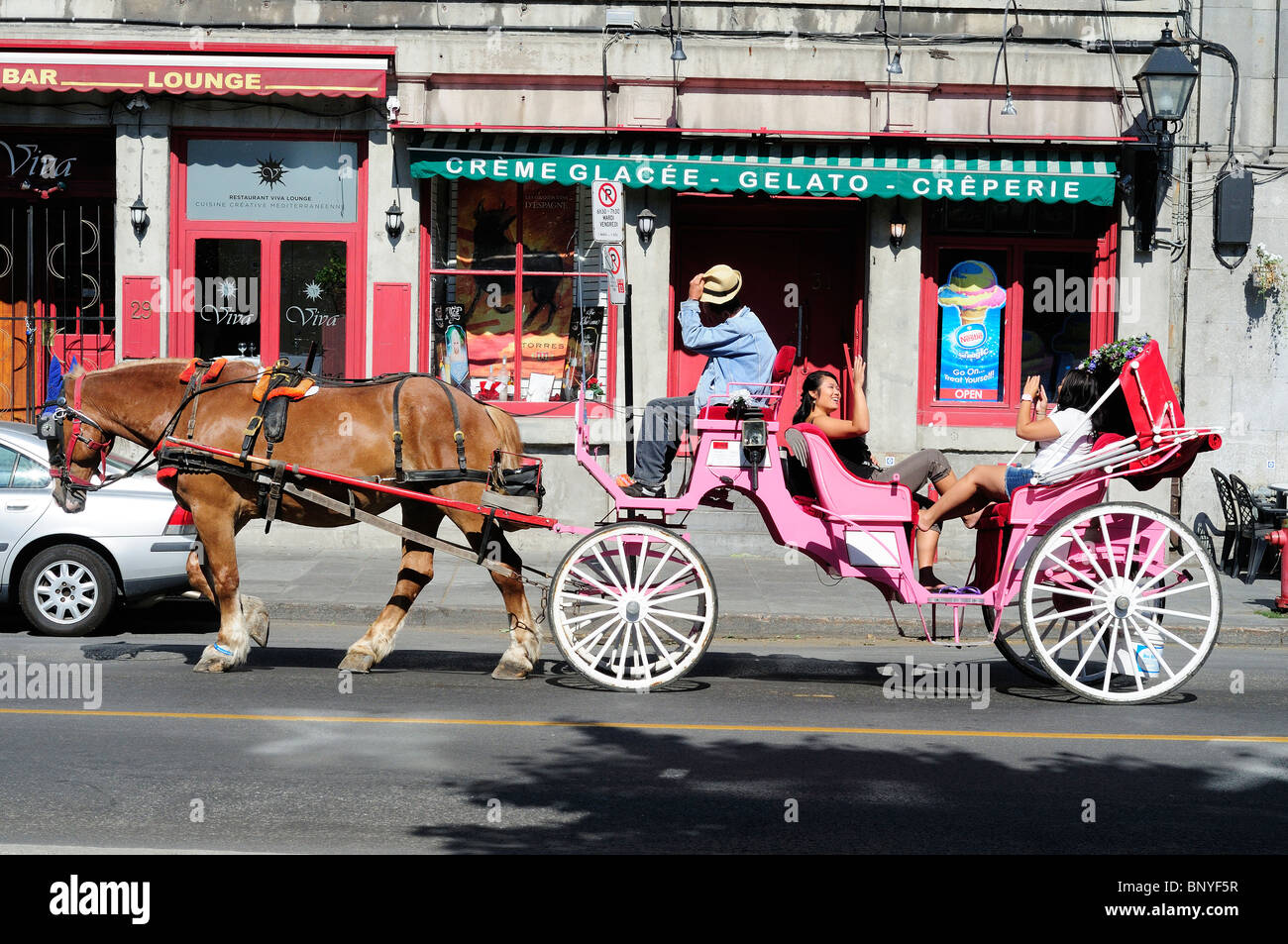Two Tourists Enjoying A Horse Drawn Buggy Ride On The Streets Of Old ...