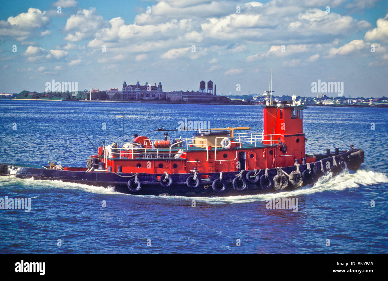 Commercial tug boat in Manhattan harbor Beautiful blue sky white puffy ...