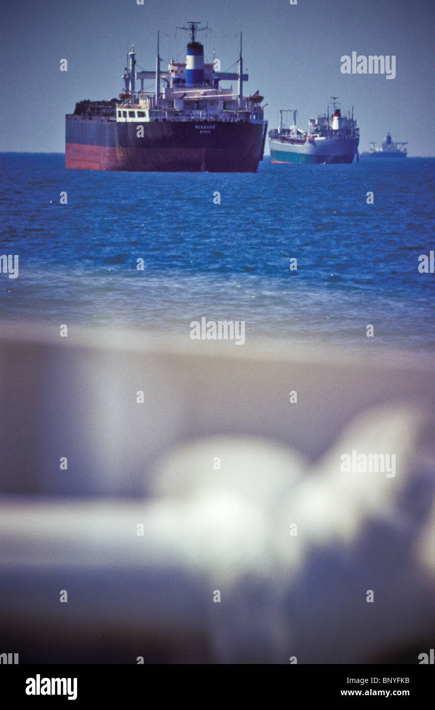 Three ocean going freighters in bay Stock Photo - Alamy