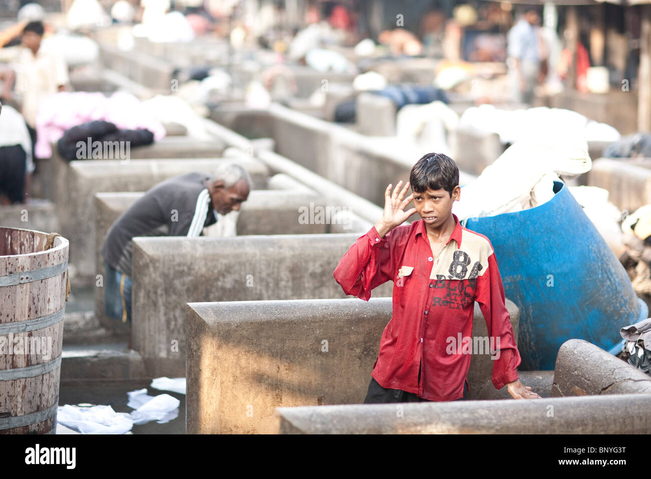 A young Dhobi at work at the Dhobi Ghat, in Mumbai India Stock Photo ...