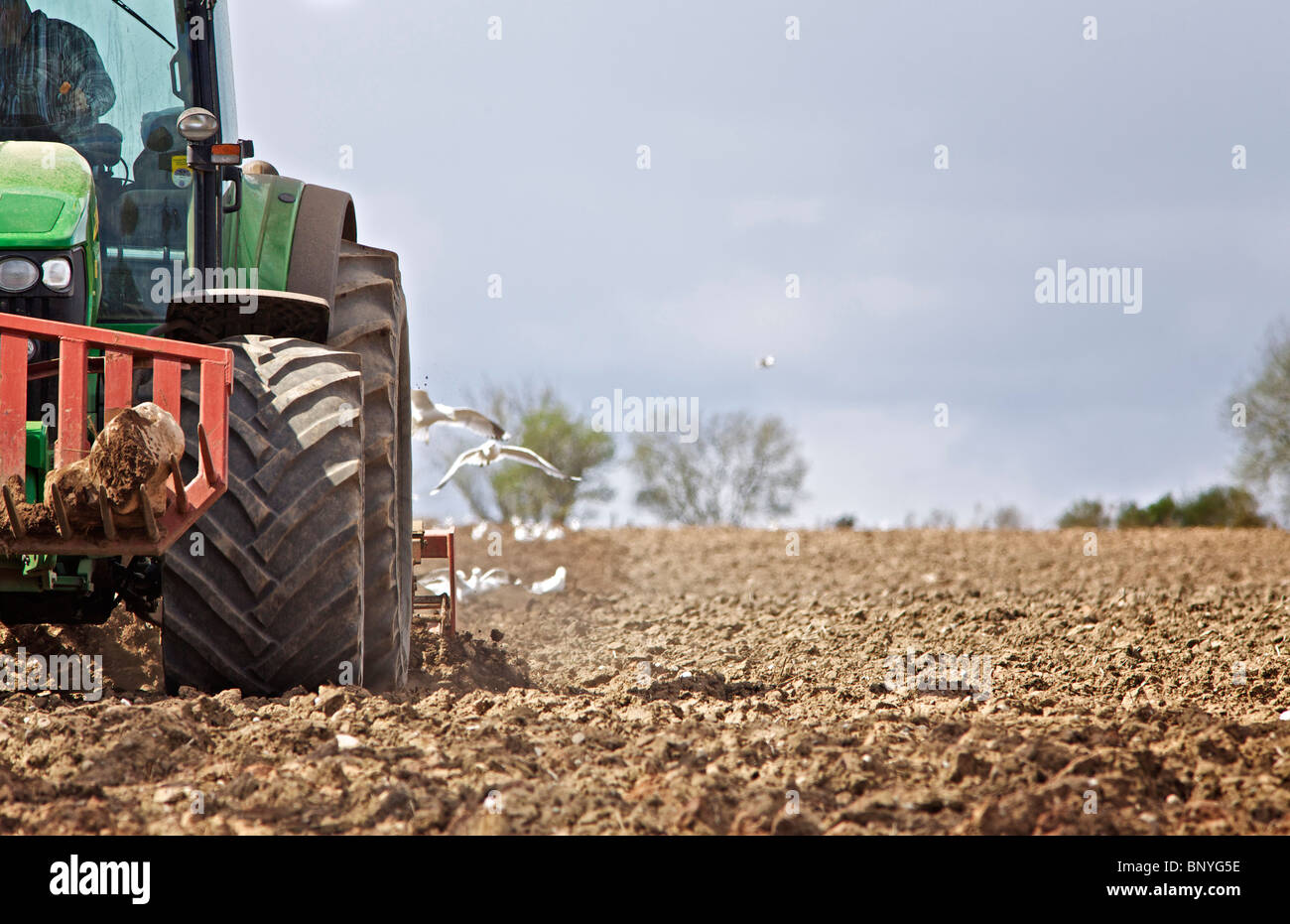 Tractor Harrowing Field In Spring High Resolution Stock Photography and ...