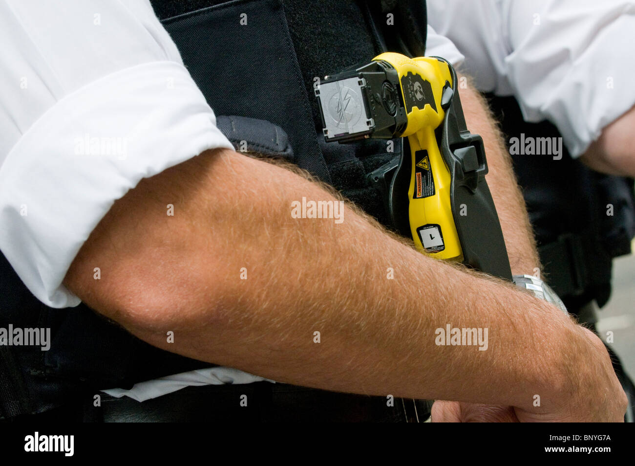 POLICE OFFICER WITH A TASER OUTSIDE THE OLD BAILEY, LONDON Stock Photo ...