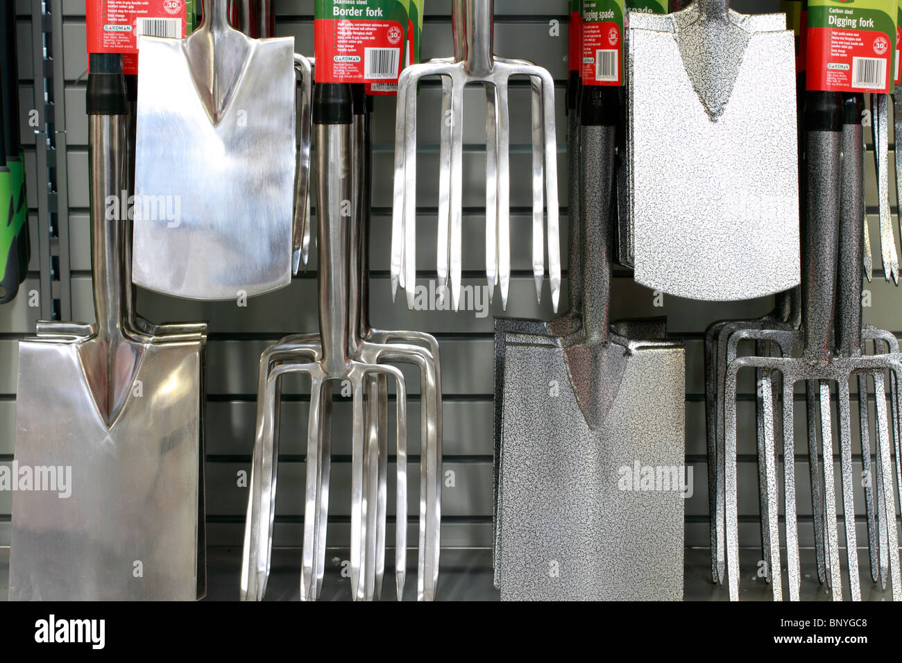 gardening tools hanging. Spades, shovels and gardening forks Stock ...