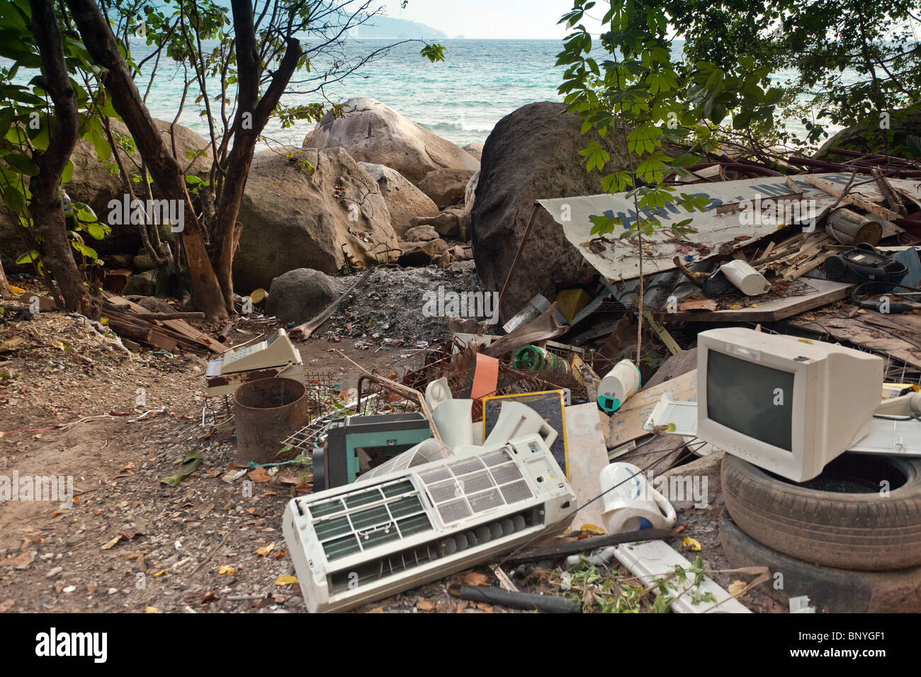 garbage of electronics objects on tropical coastline Stock Photo - Alamy