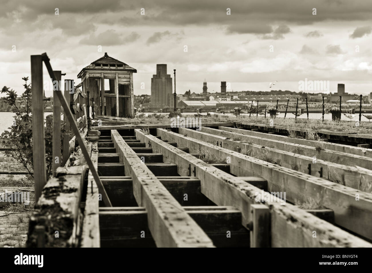 A decaying wooden structure on the waterfront Stock Photo - Alamy