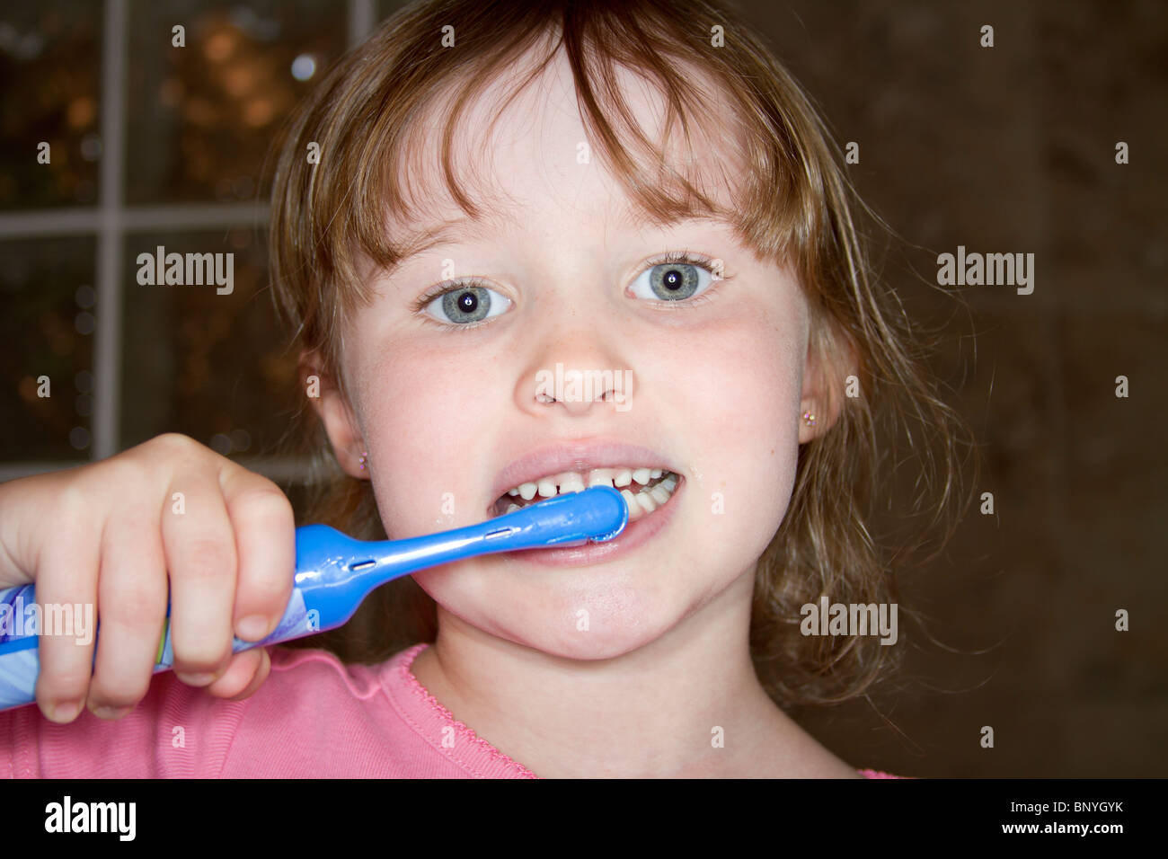 Young girl brushing her teeth Stock Photo - Alamy