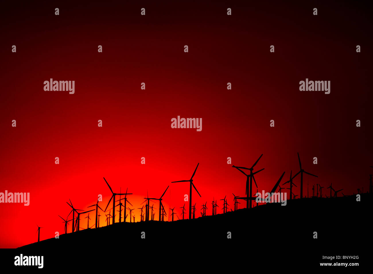 Wind turbines with different colored background colors Stock Photo - Alamy