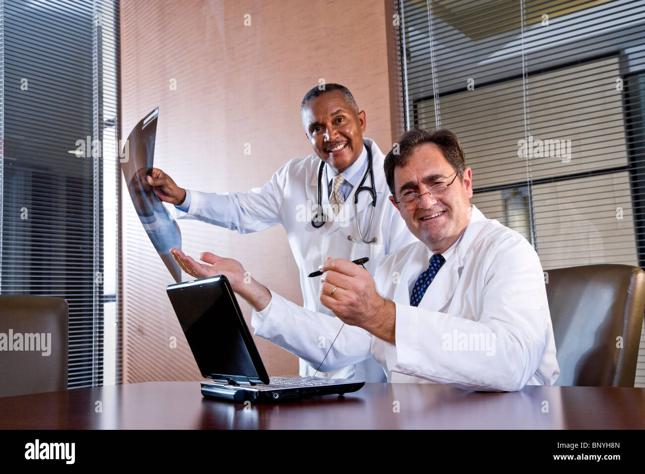 Diverse doctors working in office hi-res stock photography and images ...