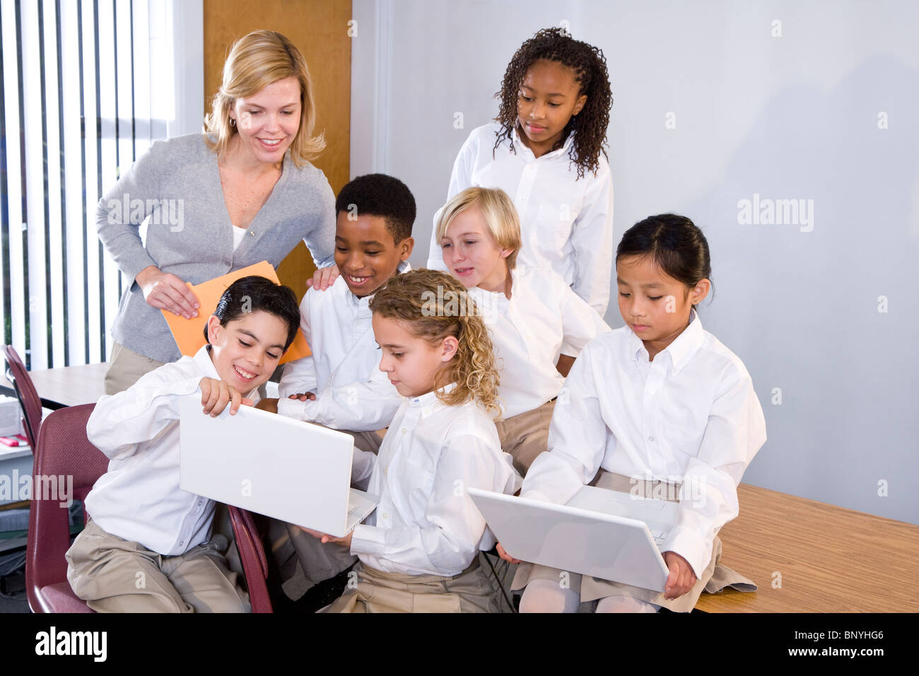 School laptops teacher uniform hi-res stock photography and images - Alamy