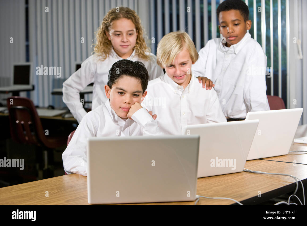Group of 4 kids in class hi-res stock photography and images - Alamy