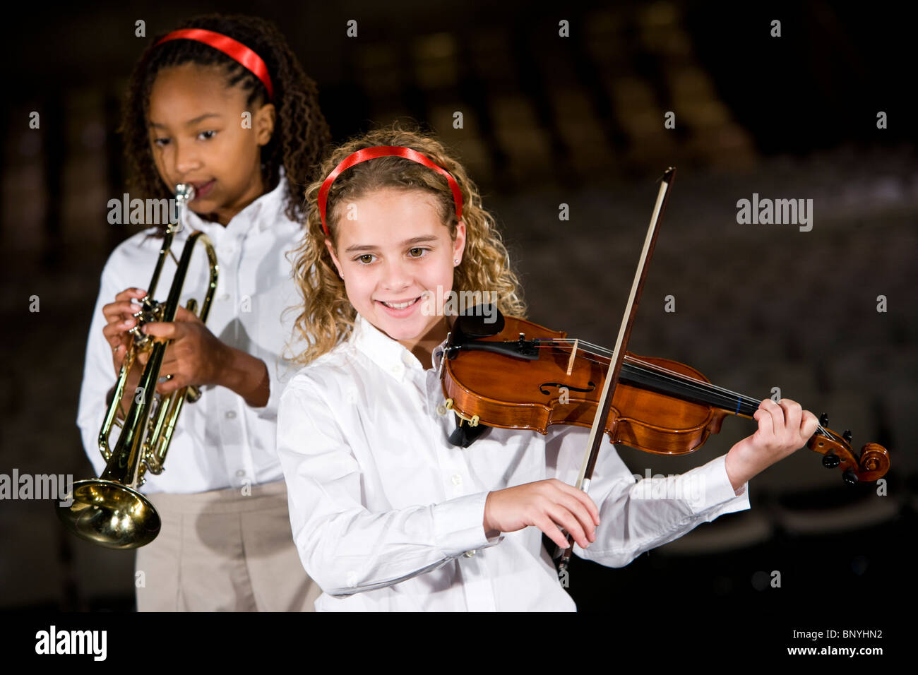 Children playing musical instruments hi-res stock photography and ...